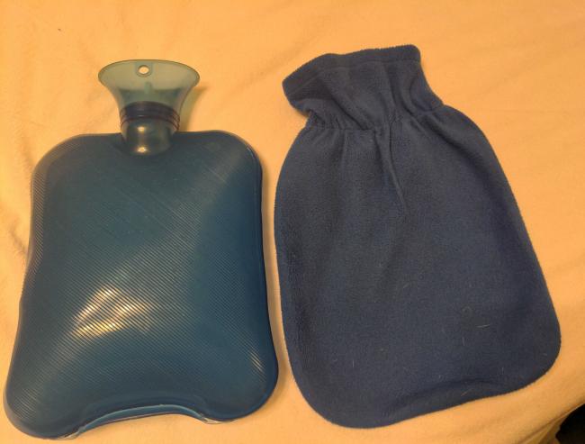 Using a vintage hot water bottle to stay warm and lower your energy ...